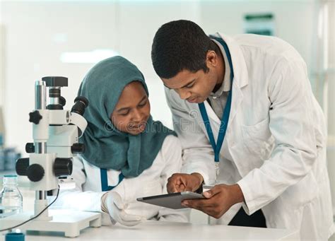 Conducting Cutting Edge Research Thatll Transform The World Two Scientists Using A Digital