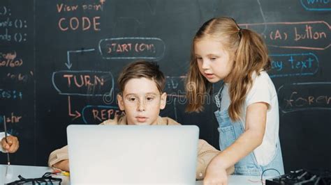 Boy Using Laptop Programing Engineering Code And Writing Program