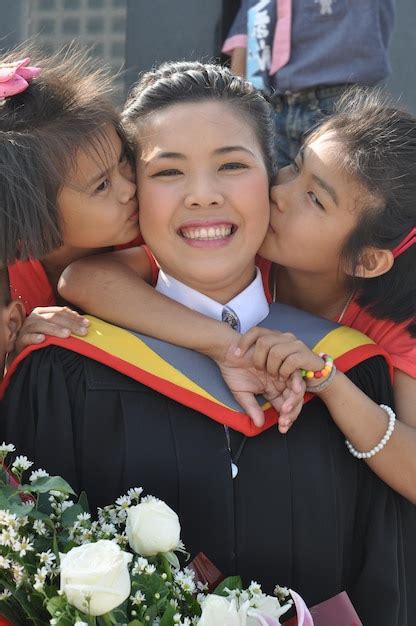 Premium Photo Close Up Of Girls Kissing Woman