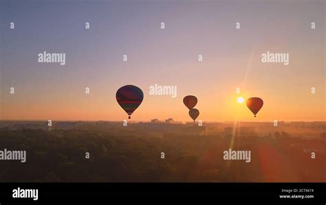 Aerial Drone View Of Colorful Hot Air Balloons Flying Over Green Park