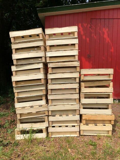 Premium Photo Stack Of Pallets On Field