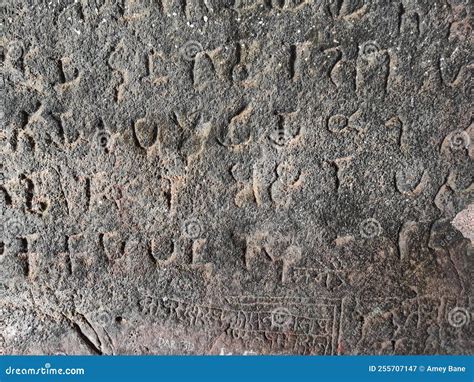 Old Ancient Scriptures Written In Brahmi Script On Stone Wall In Naneghat Caves Stock Image