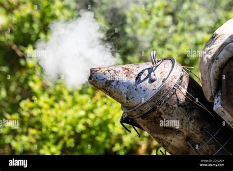 Old Rust Hive Smoker Smoking Stock Photo Alamy