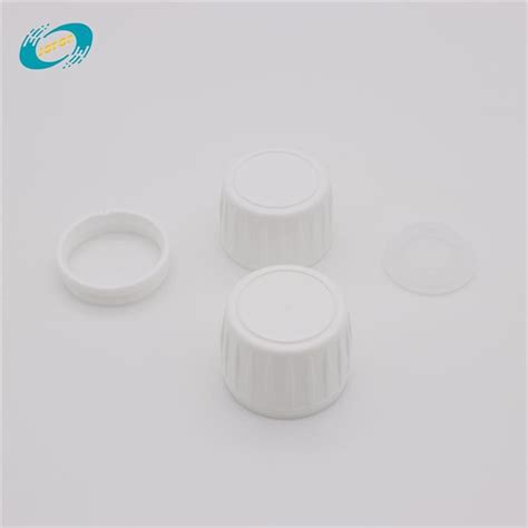 China 28mm Pp Plastic Cap With New Type Curved Ribbed Line Manufacturers And Suppliers