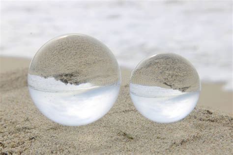Crystal Balls On A Sandy Beach Reflecting Ocean Waves Stock Image Image Of Shore Artistic