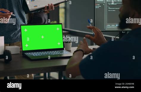 Database Admins Analyzing Source Code And Greenscreen Display On Computer Stock Video Footage