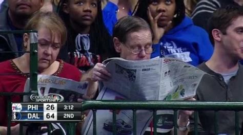 Fans At Mavs Sixers Game Read Newspaper Larry Brown Sports