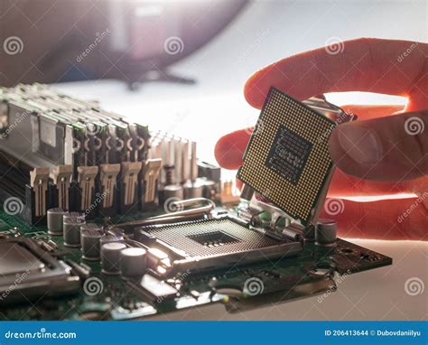 The Process Of Connecting The CPU To The Processor Socket On A Modern Computer Motherboard