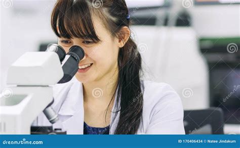 Medical Technologist Is Working In The Laboratory Using A Microscope