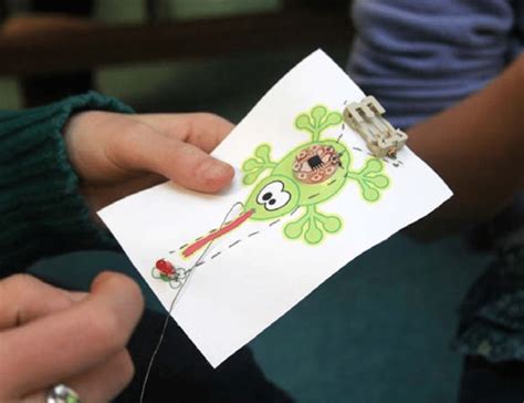 A Light Up Patch Being Sewn By A Workshop Participant Download