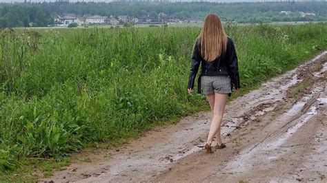 Woman Walking Barefoot In Mud