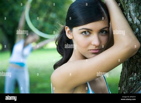Woman Leaning On The Tree Stock Photo Alamy