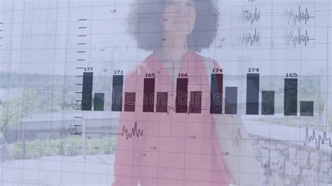 Bar Chart And Line Graph Animation Over Woman Walking Outdoors Stock