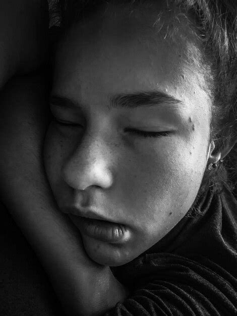 Premium Photo Close Up Of Girl Sleeping At Home