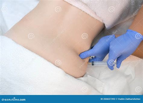 Doctor Makes Injection Of Ozone Gas In Patient Abdomen On Side On Ozone