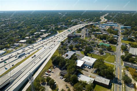 Premium Photo Aerial View Of Freeway Overpass Junction With Fast Moving Traffic Cars And