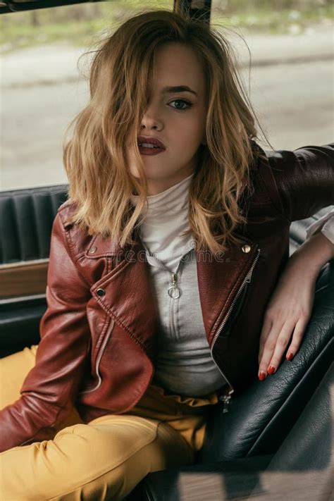Seductive Girl In Leather Jacket Looking At Camera While Sitting In Car Stock Image Image Of