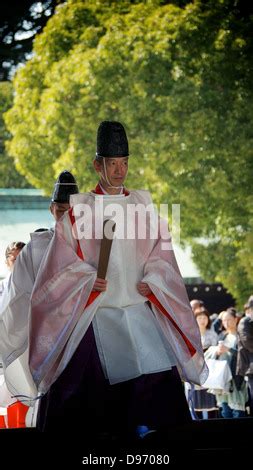 Shinto Priest Kannushi At Meiji Shrine Conducting Religious Rites For