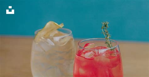 Clear Drinking Glass With Red Liquid And Ice Photo Free Cocktail Image On Unsplash