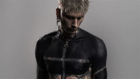 Machine Gun Kelly Unveils Spiritual Blackout Tattoo