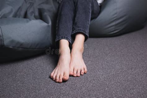Bare Feet Of A Girl A Girl In Jeans With Bare Feet Foot And Heel