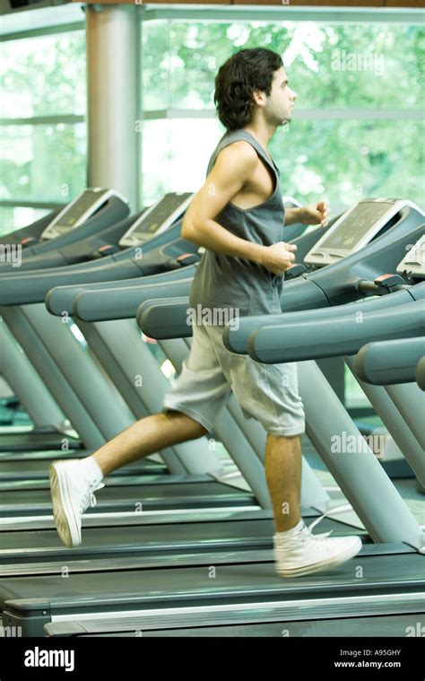 Man Running On Treadmill Stock Photo Alamy