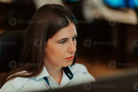 Female Security Operator Working In A Data System Control Room Offices Technical Operator