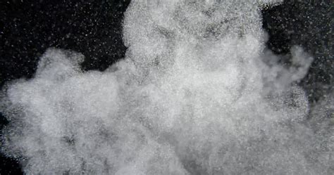 Particles Of Dust Flour Debris Flying On Black Background Red Camera Footage In Slow Motion