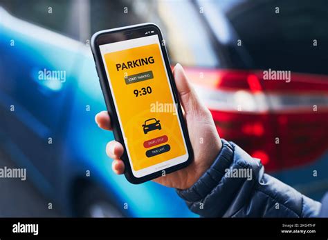 Woman Using Mobile Parking App On Smartphone Driver Using Smartphone To Pay For Parking Car