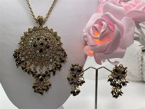 Close Up Of An Assortment Of Jewelry Displayed On A Necklace Stock