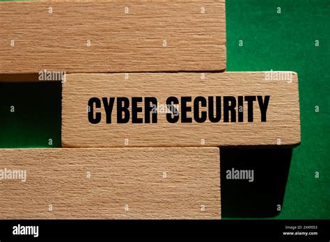 Cyber Security Message Written On Wooden Block With Green Background