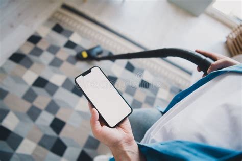 Cropped Photo Of Young Ginger Girl Hold Device White Screen Vacuum Cleaner Dressed Blue Garment