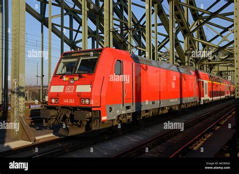 A Passenger Service Hauled By A Class 146 Locomotive Crosses The Rhine
