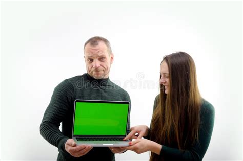 Two Software Developers Analyzing Source Code Looking At Green Screen
