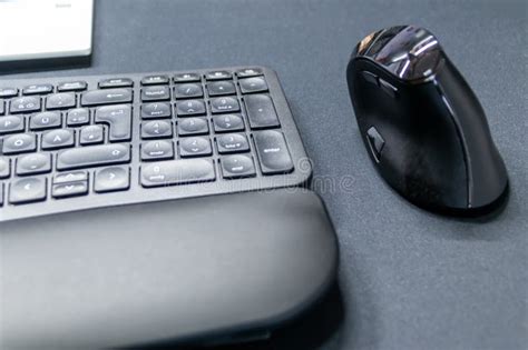 Modern Home Office Equipment With Ergonomic Keyboard And Mouse And Multiple Monitors Setup Stock