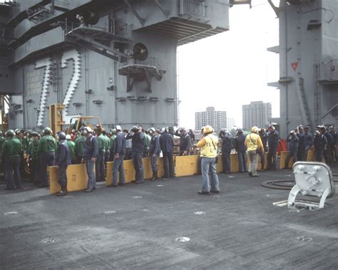 Flight Deck Crew Members On The Nuclear Powered Aircraft Carrier Uss