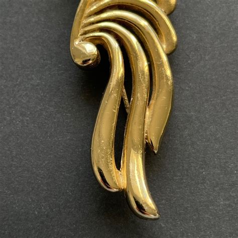 Vintage Monet Pin Brooch Art Deco Ribbon Bow Wave Fea… Gem