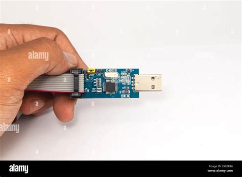 An AVR Microcontroller USB Downloader Held In One Hand Stock Photo Alamy