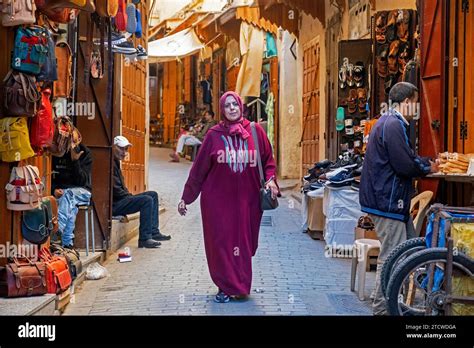 Moroccan Muslim Woman Wearing Djellaba Jillaba And Hijab In Alley