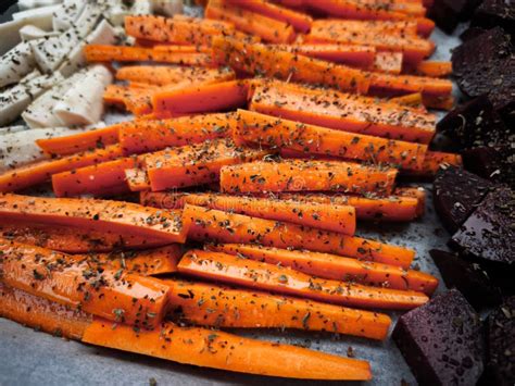 Seasoned Carrot Sticks With Beetroot And Parsnip Ready For Roasting Healthy Dinner Snacks Stock