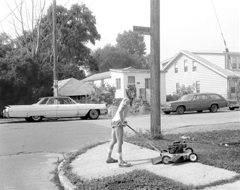A Teenage Girl Mows The Lawn On The Corner Of Naughton Ave Staten