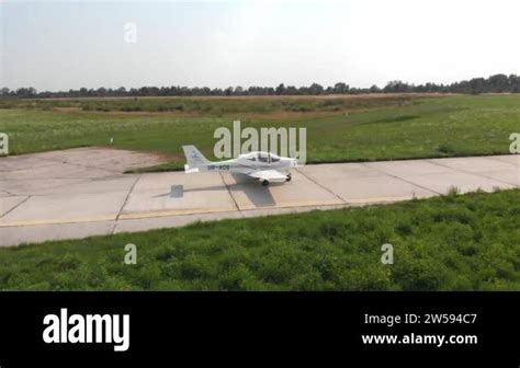 Small Private Jet Airplane With Spinning Propeller Stand On Landing