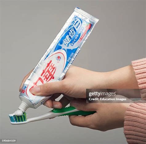 Woman Squeezing Toothpaste Photos And Premium High Res Pictures Getty