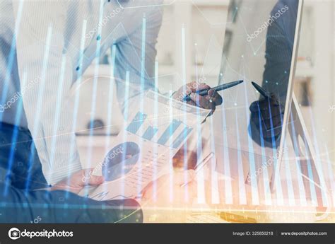 Double Exposure Of Chart With Businessman Typing On Computer In Office On Background Concept Of