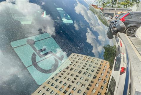 Visible Disability Placard Placed Behind A Car Windshield Sign