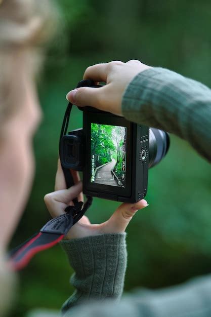 Free Photo Selective Focus Shot Of A Girl Using A Professional Camera