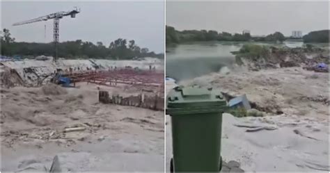Watch Landslide In Puchong Causes Riverbank To Collapse And Submerge A Construction Site