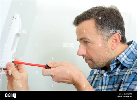 Attaching An Intercom System Stock Photo Alamy