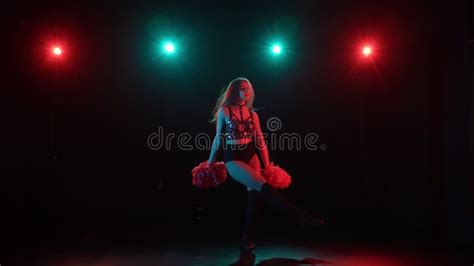 Cute Young Cheerleader Is Dancing Cheering Dance Waving Orange Pompoms