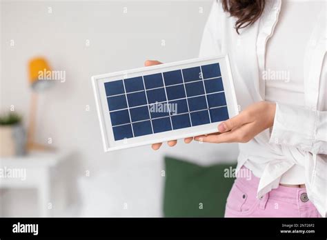 Teenage Girl With Portable Solar Panel In Bedroom Closeup Stock Photo Alamy